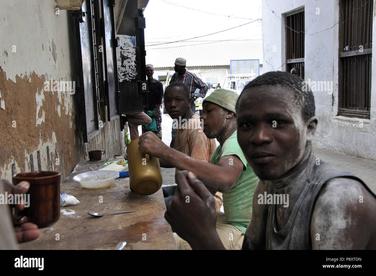 Kenya: Street-workers having a coffee-break in the streets of Mombasa ...