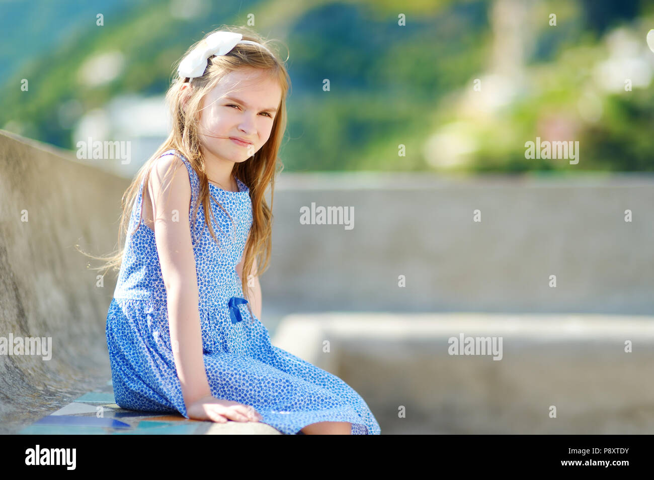 Adorable little girl on warm and sunny summer day Stock Photo - Alamy