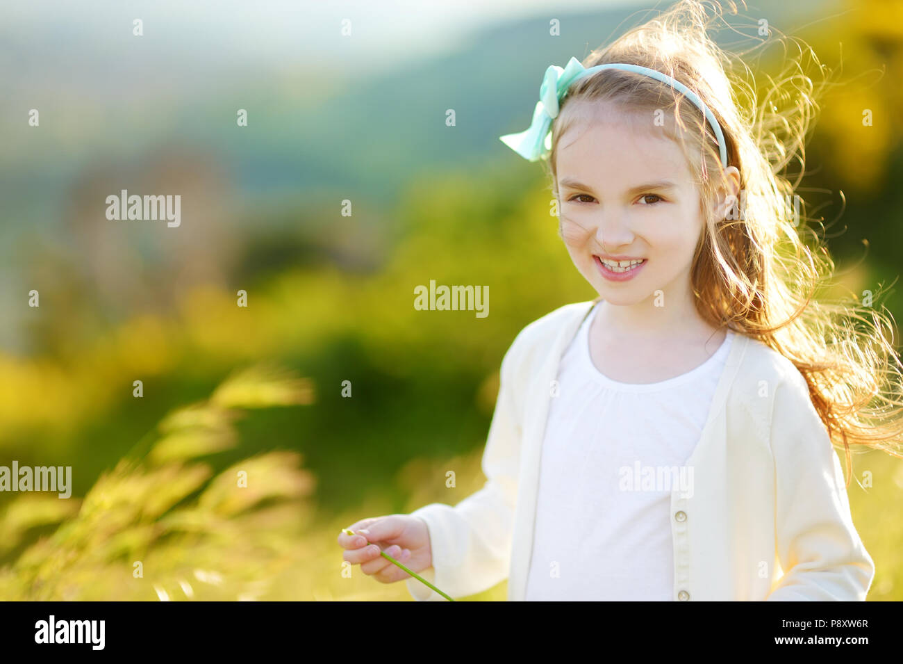 Adorable little girl on warm and sunny summer day Stock Photo - Alamy