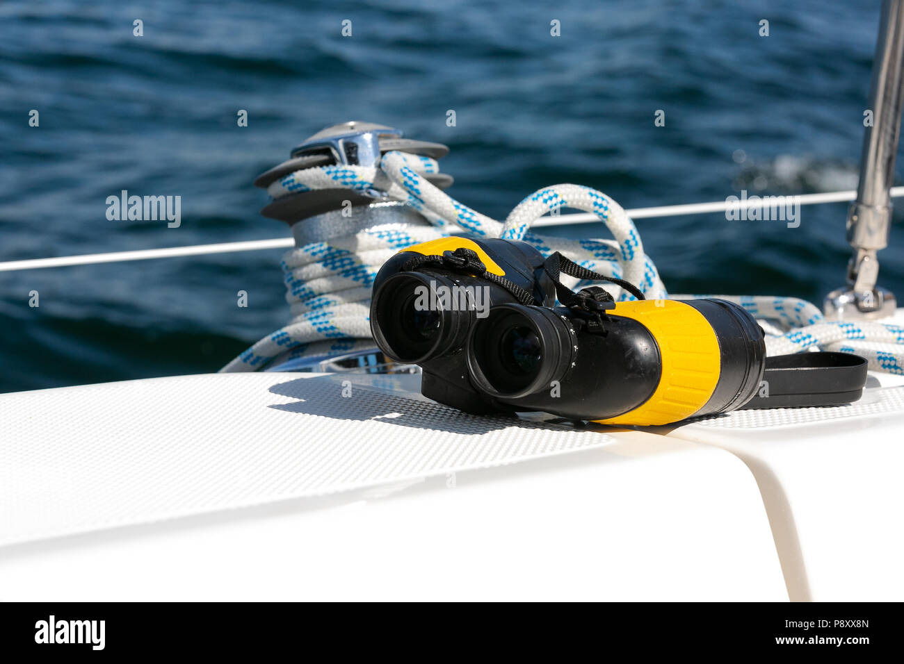 Nautical background. Binoculars and winch. Sailing boat Stock Photo - Alamy