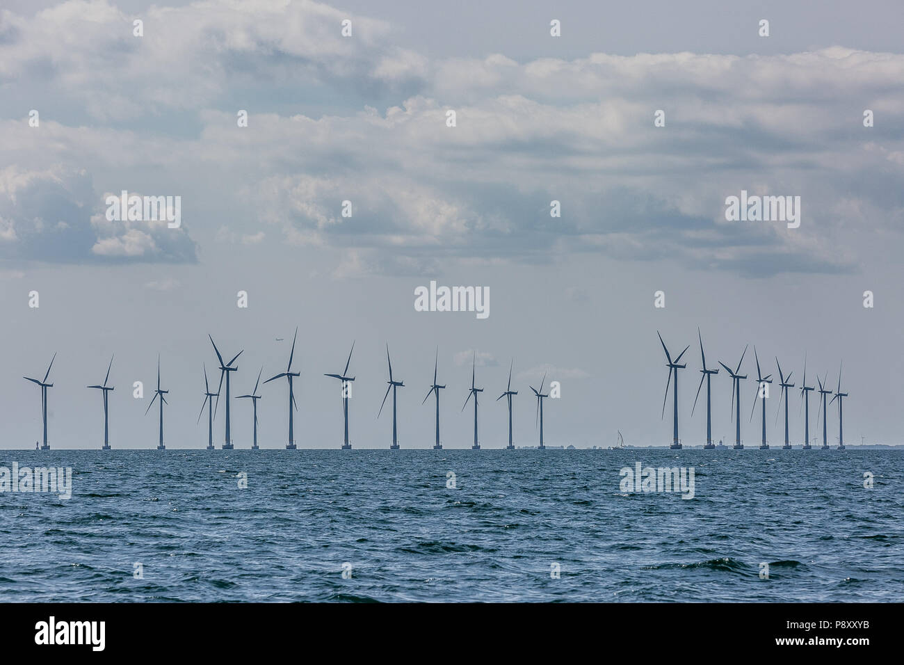 Windmills in the sea. Wind power. Green energy. Sustainability ...