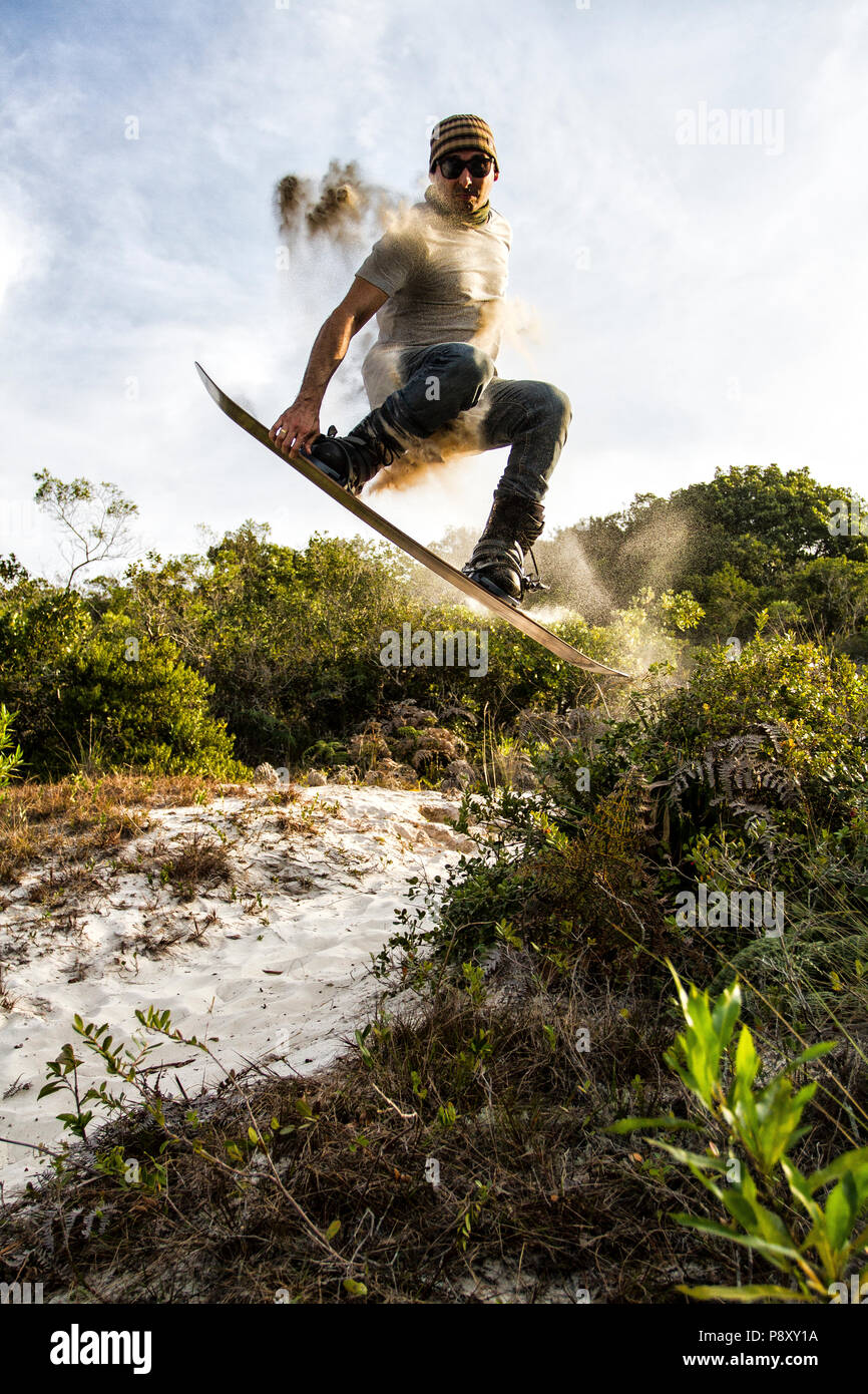 Sandboarding on the dunes of Conceicao Lagoon. Florianopolis, Santa ...