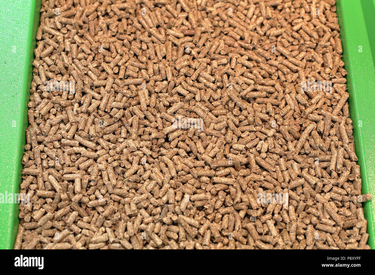 Wood pellet heating fuel made from compressed biomass Stock Photo - Alamy