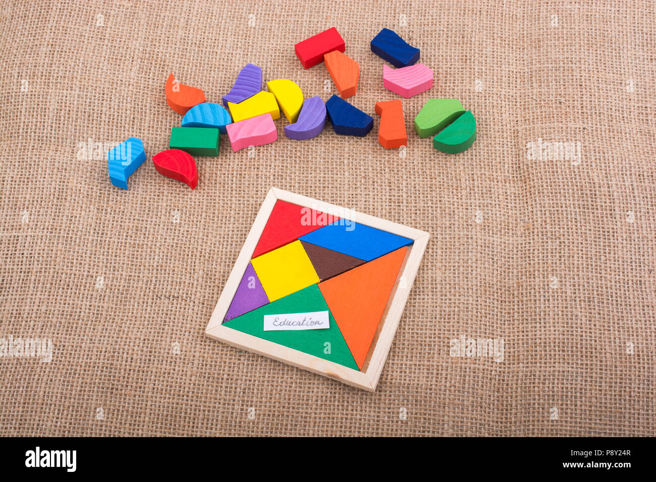 Colorful pieces of a square tangram puzzle Stock Photo - Alamy