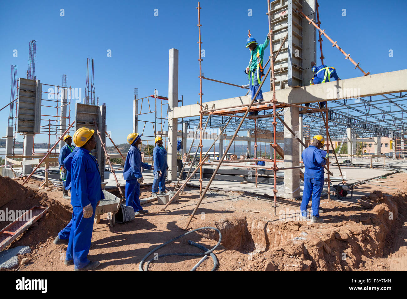 Construction workers on an outdoor construction site Stock Photo - Alamy