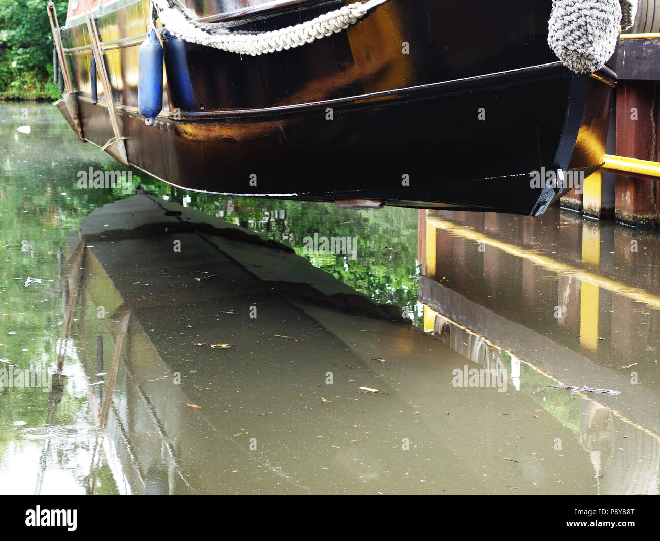 A narrowboat is lifted back into the water after its repainting at the ...