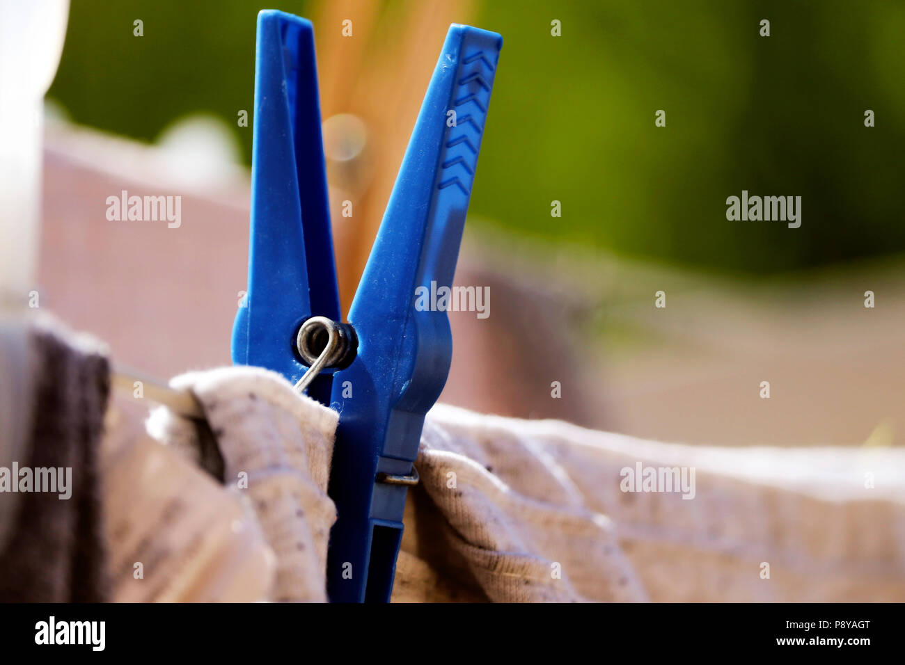 Clothes pegs on the washing line Stock Photo - Alamy