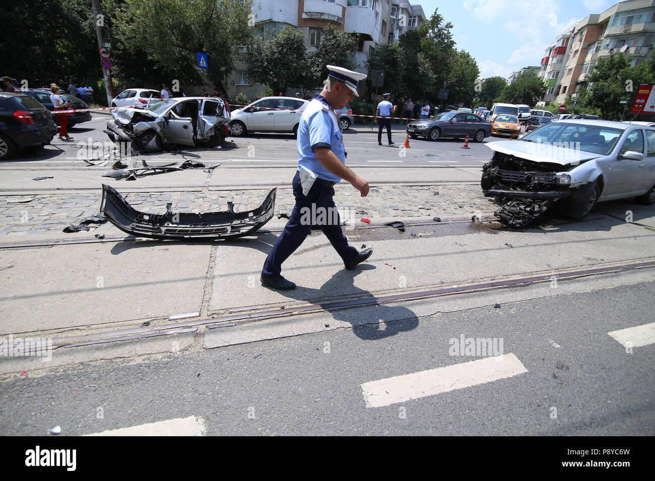 BUCHAREST, ROMANIA - JULY 13: Several vehicles are damaged on the road ...