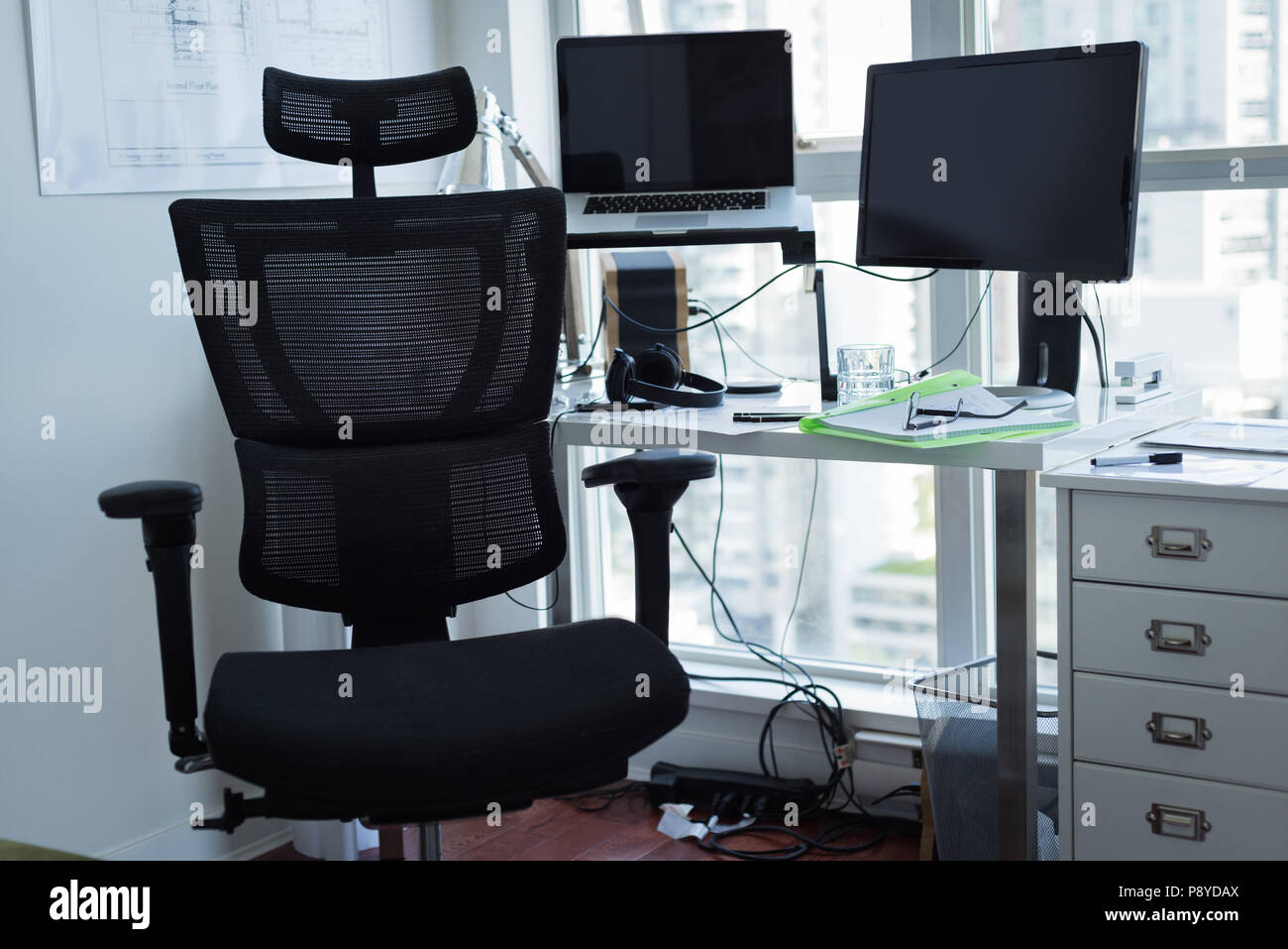 Chair with laptop and personal computer at home Stock Photo - Alamy