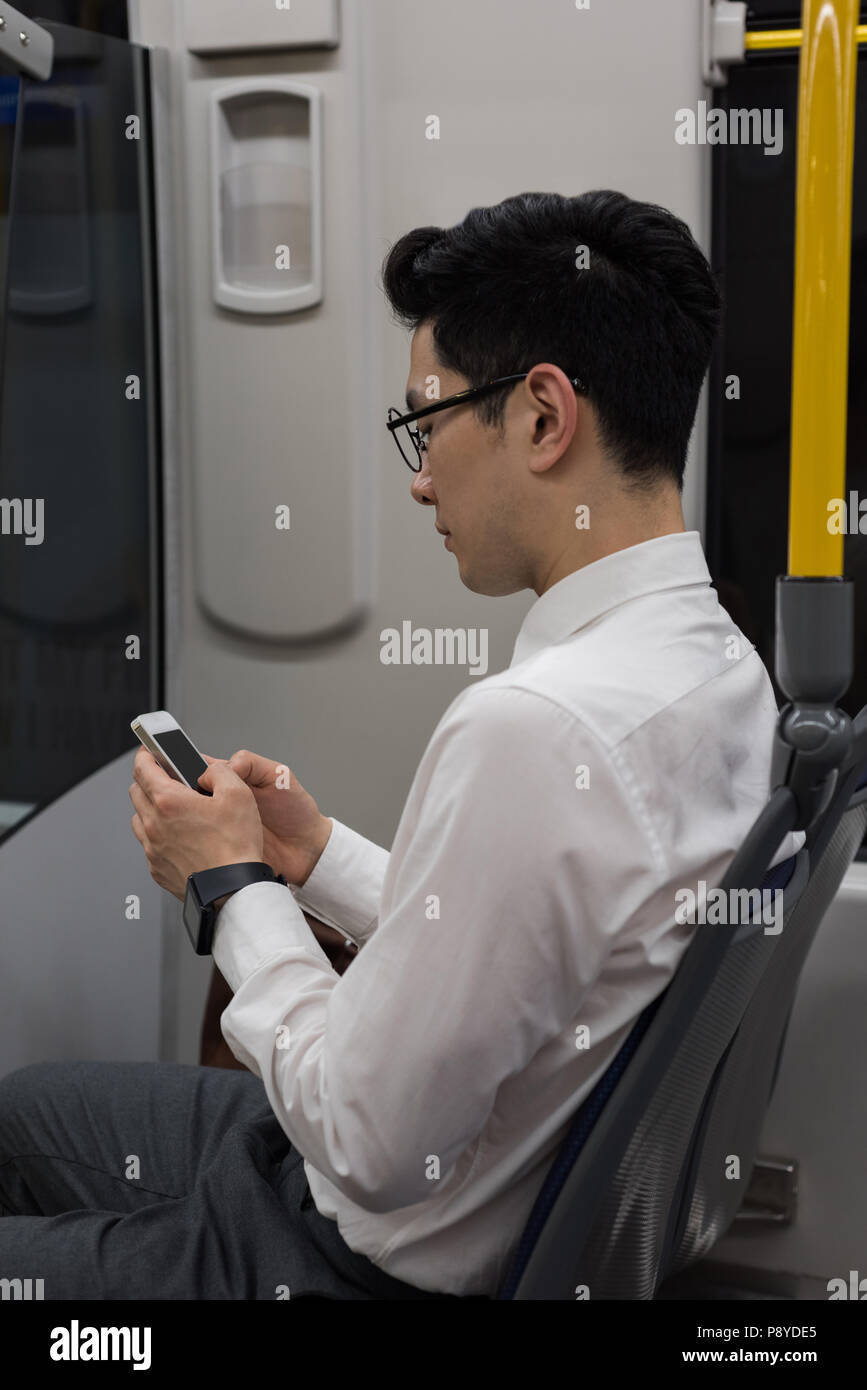 Man on train and phone hi-res stock photography and images - Alamy