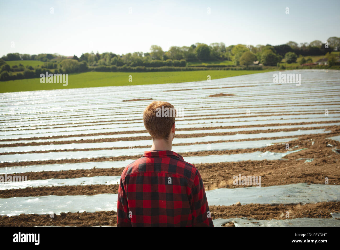 Young man standing landscape hi-res stock photography and images - Alamy