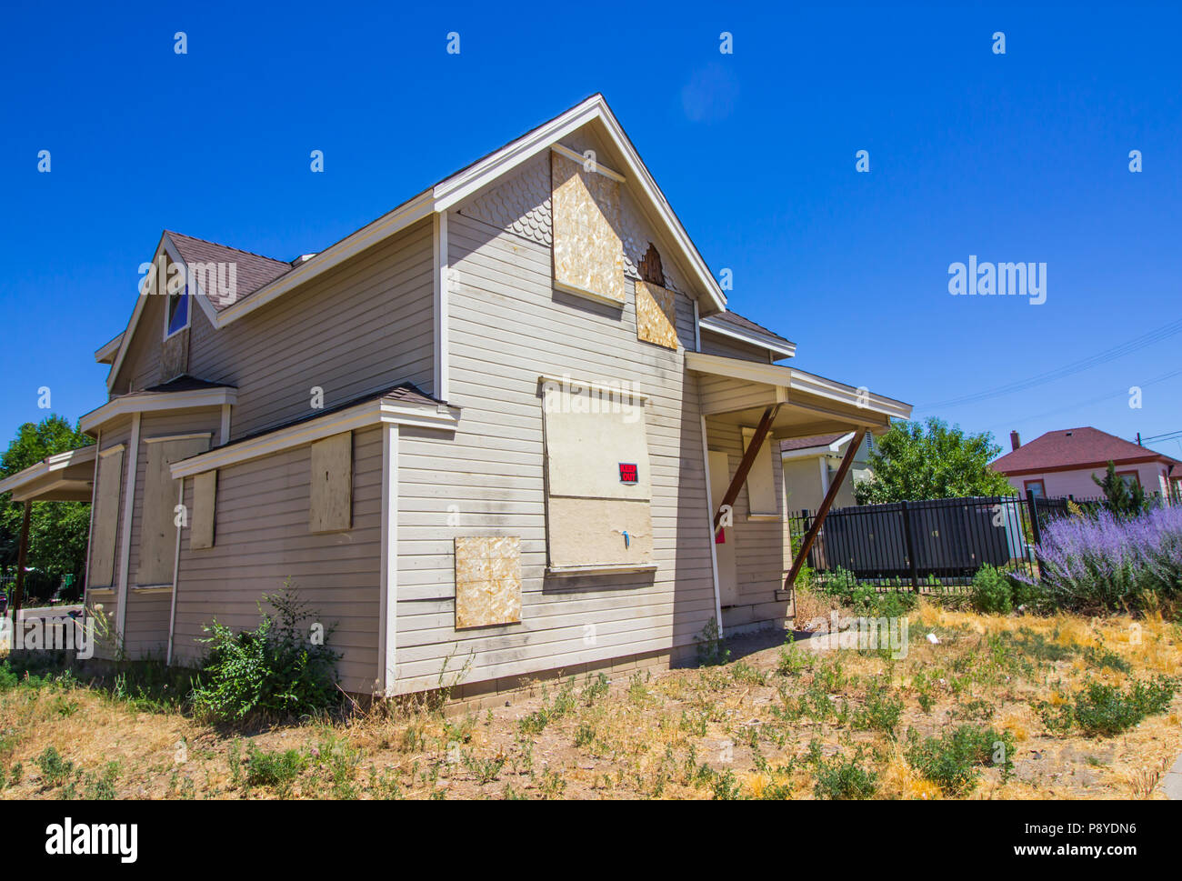 Abandoned House With Boarded Up Windows & Doors Stock Photo - Alamy