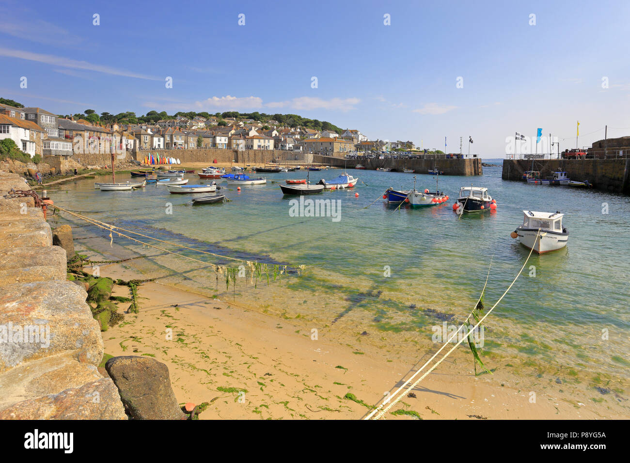 Boats in Mousehole harbour, Cornwall, England, UK Stock Photo - Alamy