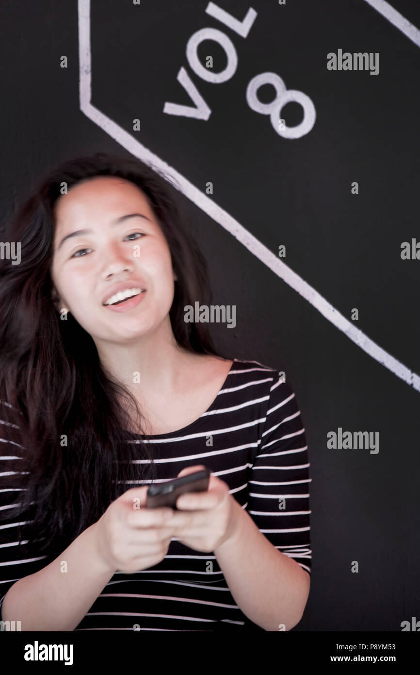 Smiling Teen Girl Texting Stock Photo - Alamy