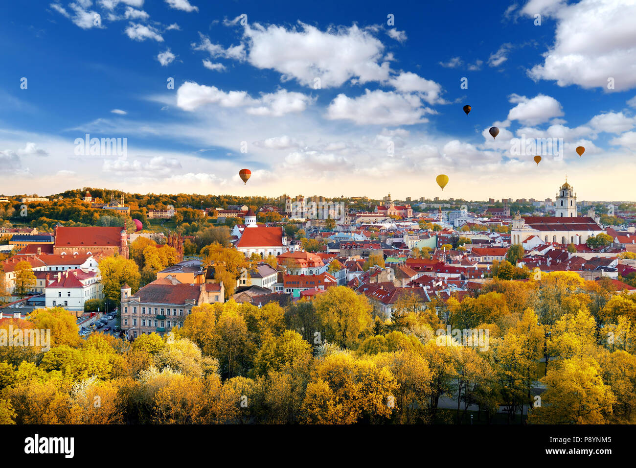 Beautiful autumn panorama of Vilnius old town with colorful hot air ...