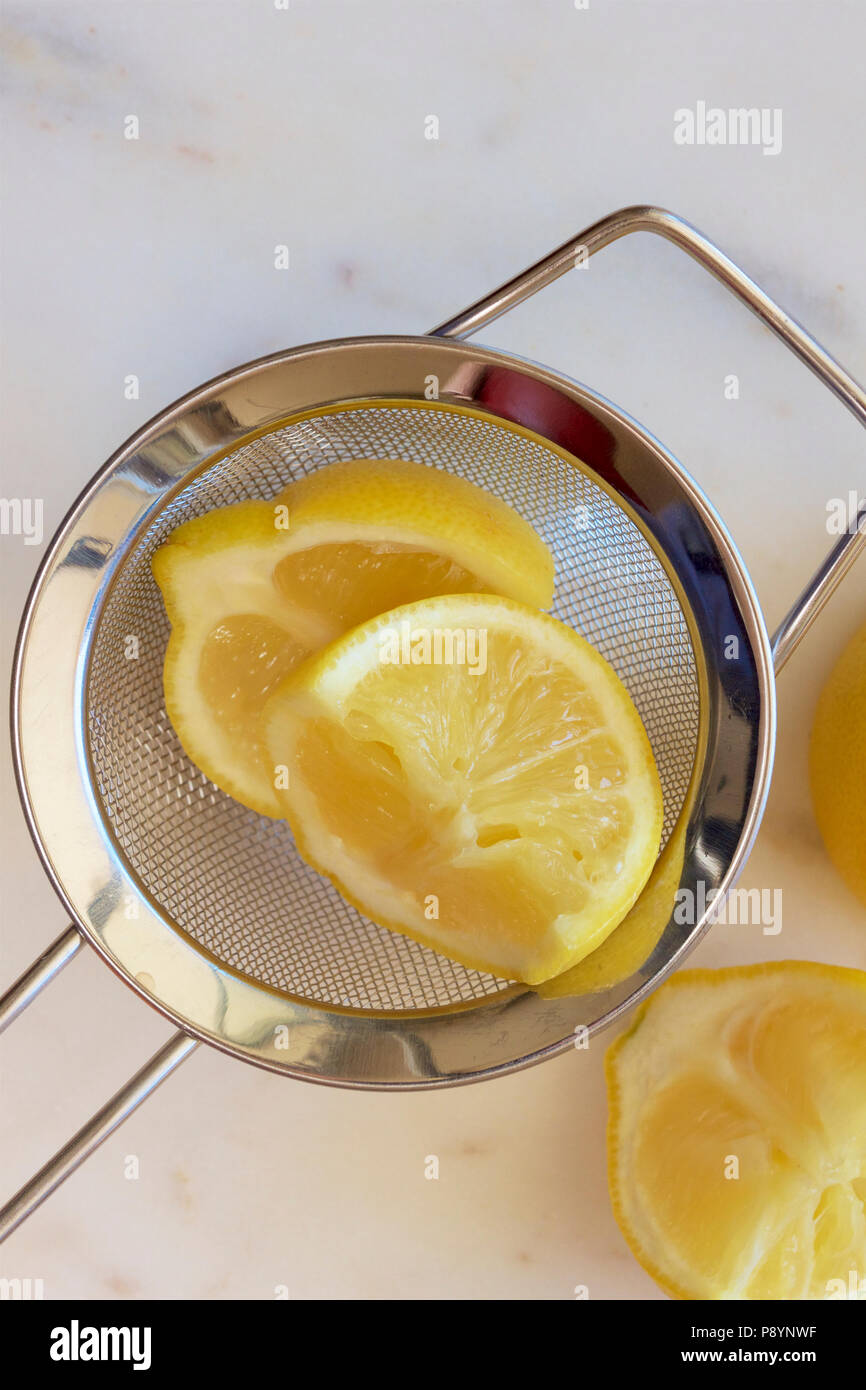 Cut lemon wedges hi-res stock photography and images - Alamy