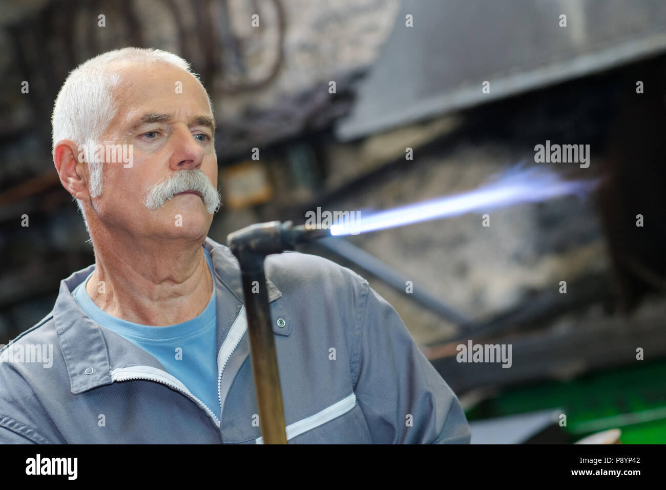 Man holding blow torch hi-res stock photography and images - Alamy