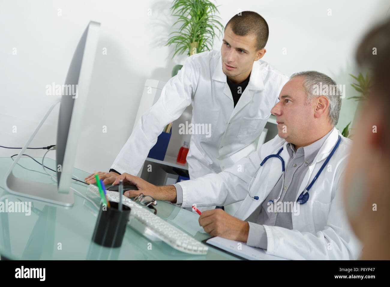 Male teaching assistant hi-res stock photography and images - Alamy