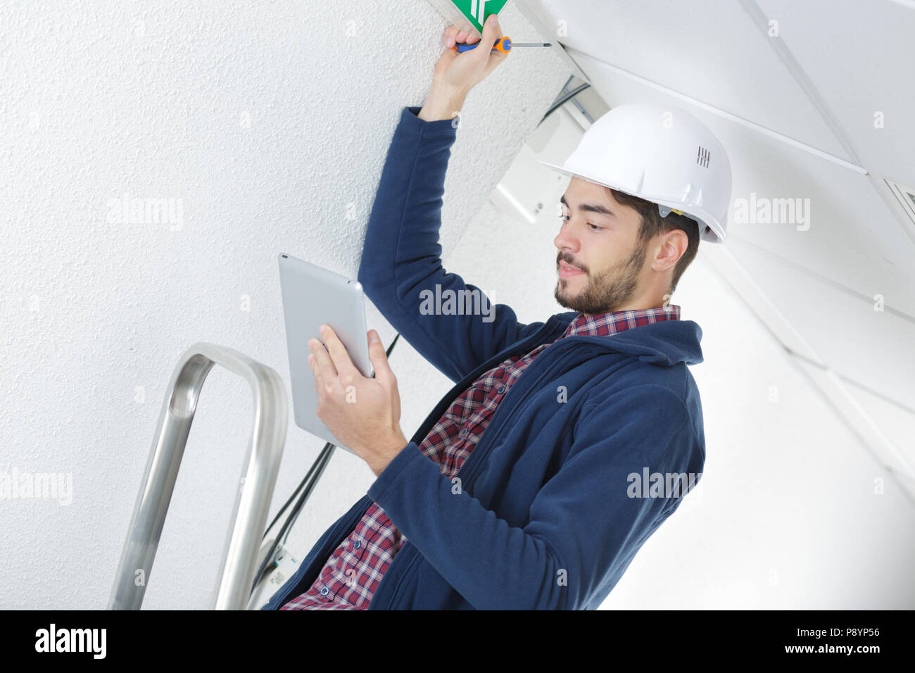 Electrician standing on ladder hi-res stock photography and images - Alamy