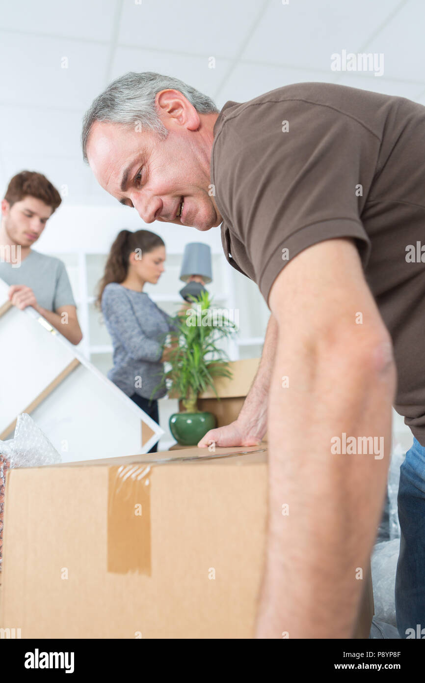 parents helping young couple to move into home Stock Photo - Alamy