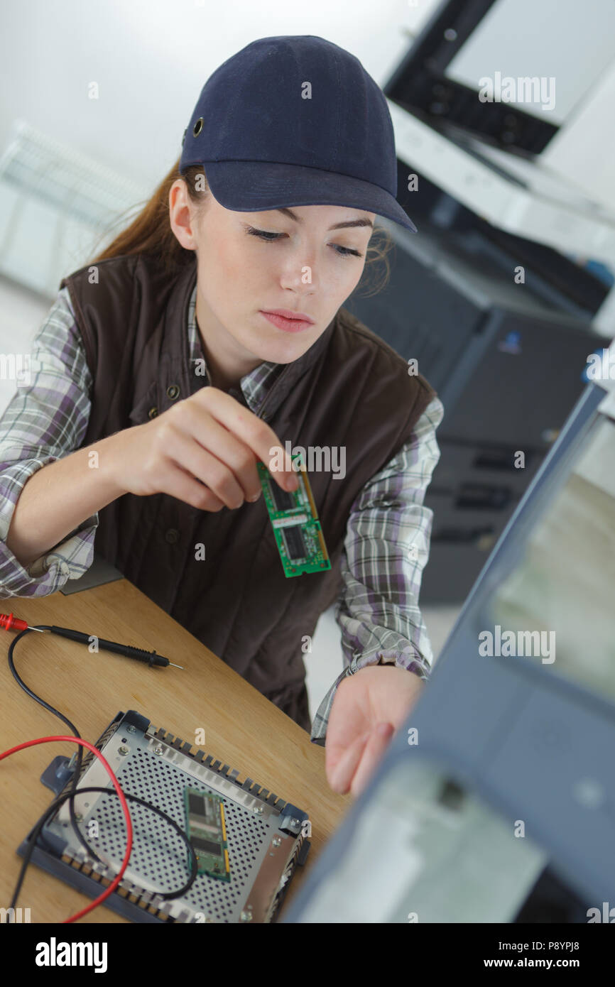 Female technician working motherboard hi-res stock photography and ...