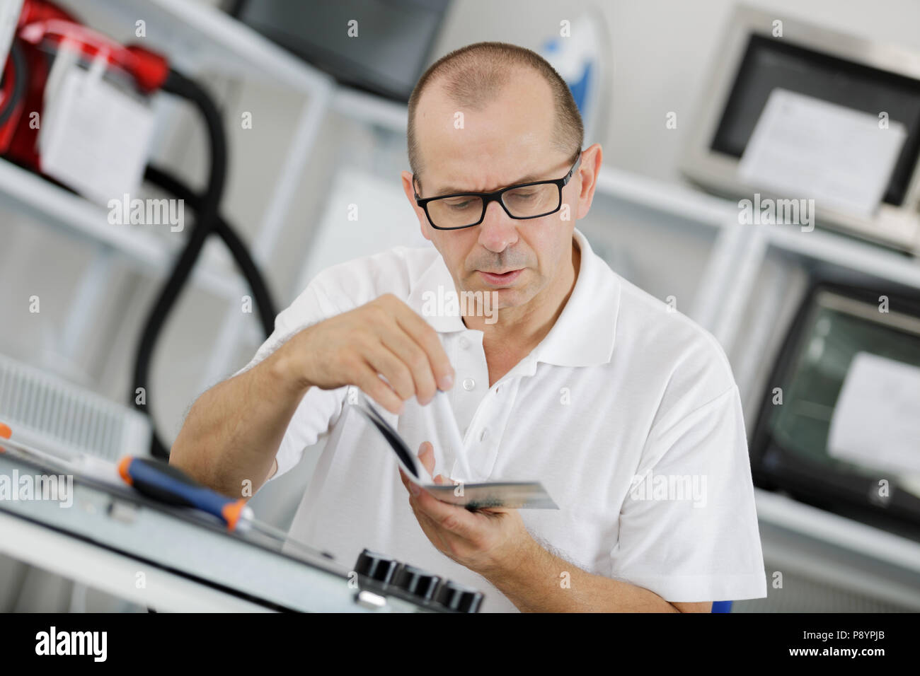Person reading instruction manual hi-res stock photography and images ...
