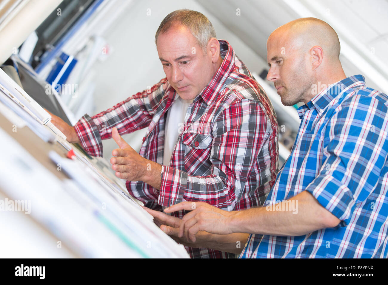 two male engineers working with new project Stock Photo - Alamy