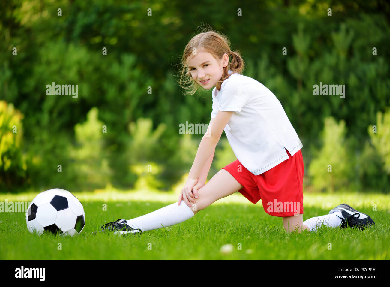 Cute little soccer player having fun playing a soccer game on sunny ...