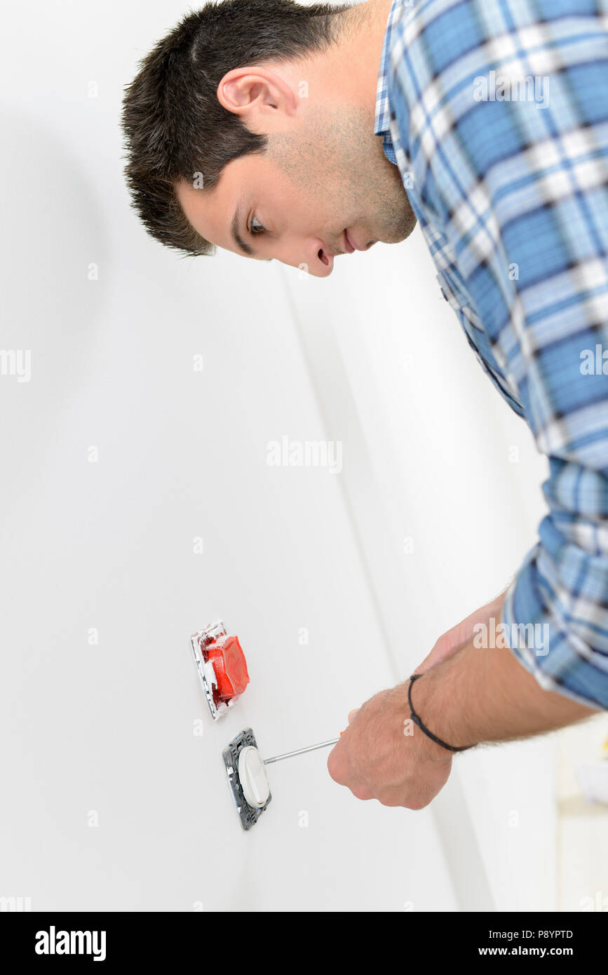 Electrician fitting a socket Stock Photo - Alamy