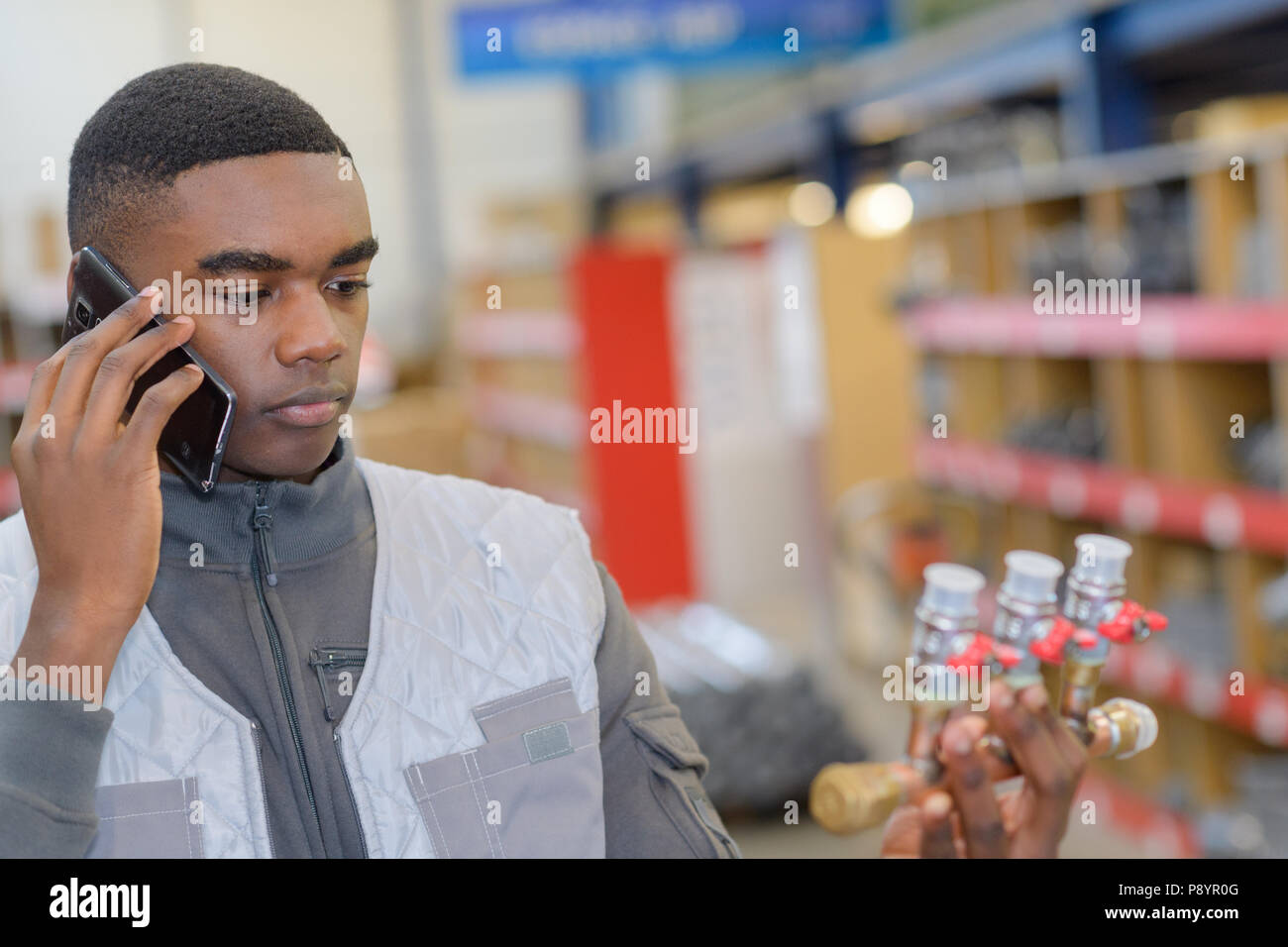 worker receiving order for plumbing parts Stock Photo - Alamy