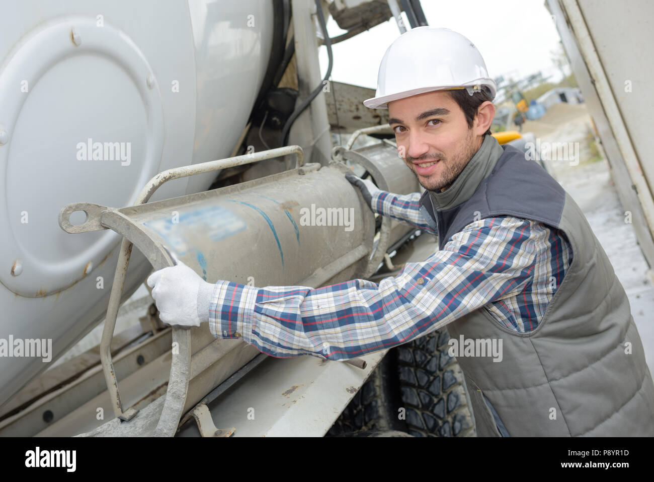 Man with cement transporting lorry Stock Photo - Alamy