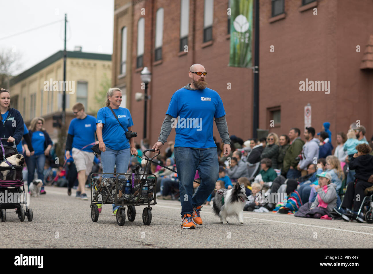 Holland, Michigan, USA - May 12, 2018 People wearing blue shirts with ...
