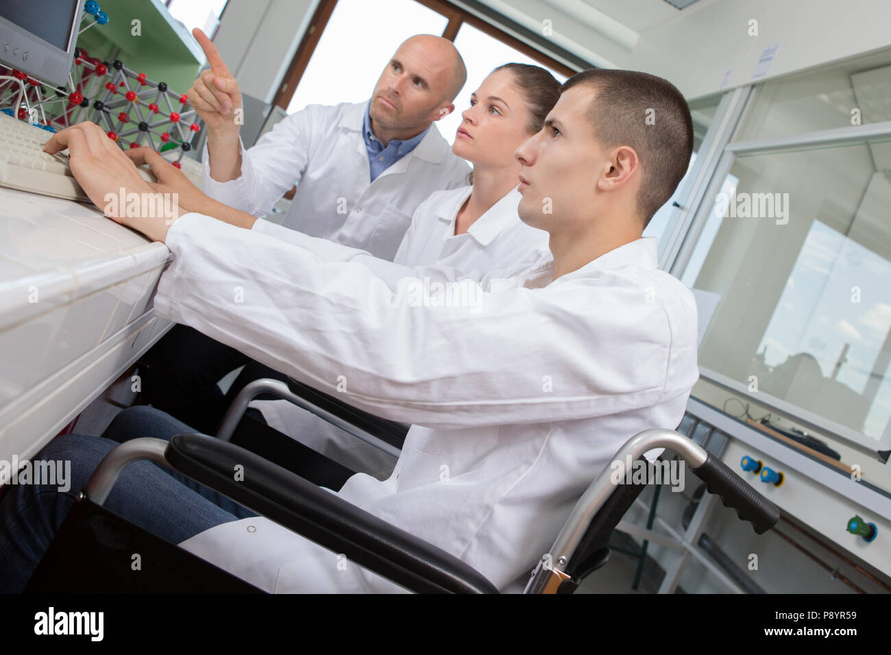disabled student during science class Stock Photo - Alamy