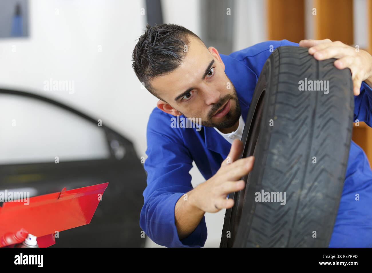 Technician checking rubber wheel hi-res stock photography and images ...