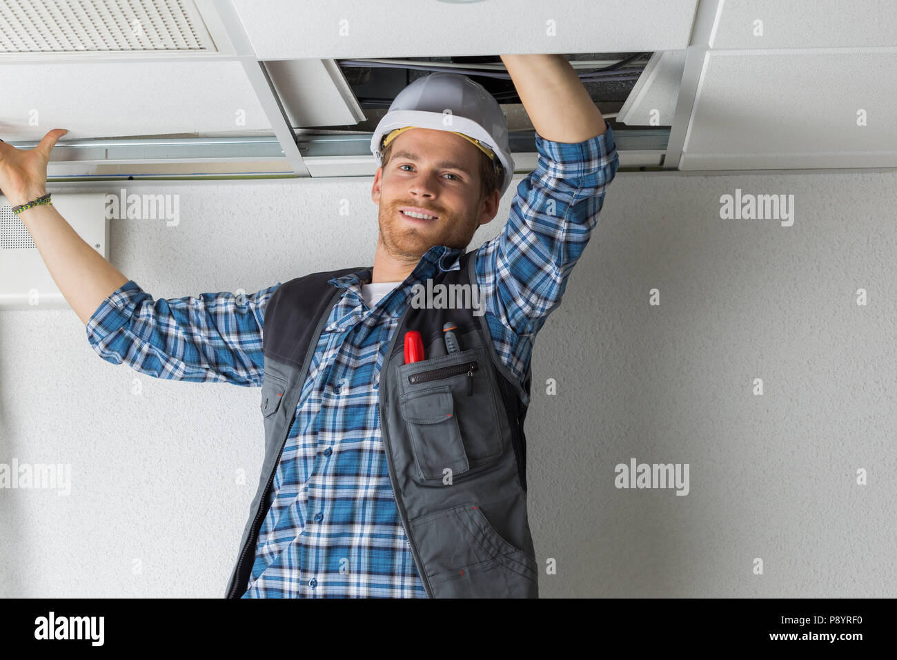 electrical worker wiring in ceiling Stock Photo - Alamy