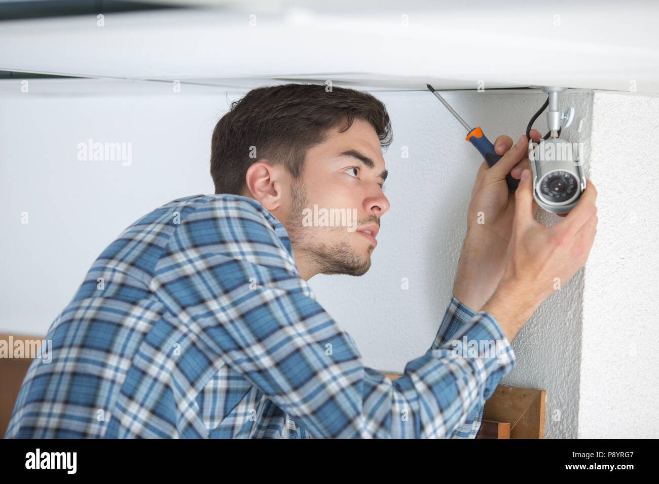 professional cctv technician working Stock Photo - Alamy