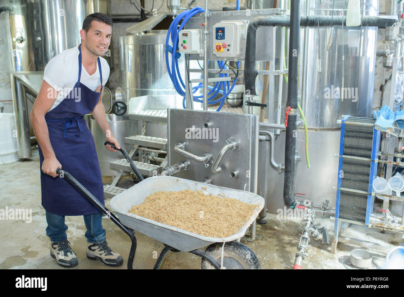 worker carrying beer malt Stock Photo - Alamy