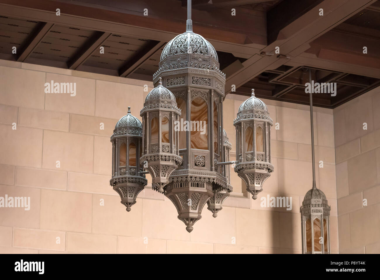 Intricate metal hanging light at Sultan Qaboos Grand Mosque in Muscat ...