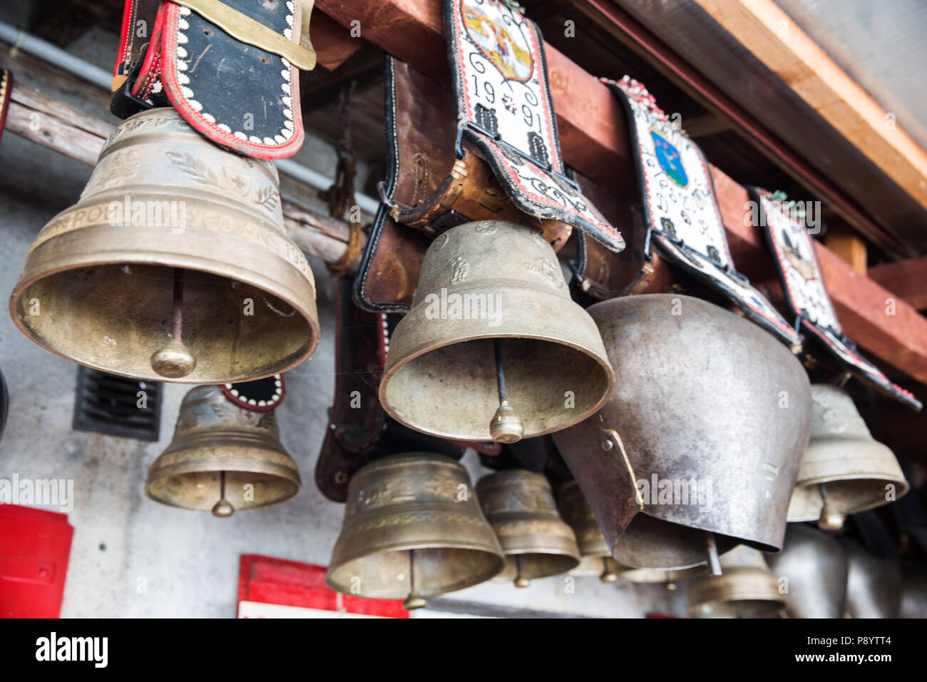 Swiss Cows Bells Hanging in Chalet as Decorations Stock Photo - Alamy