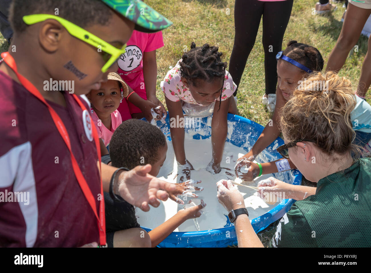 Detroit, Michigan - Children play with oobleck (cornstarch and water ...