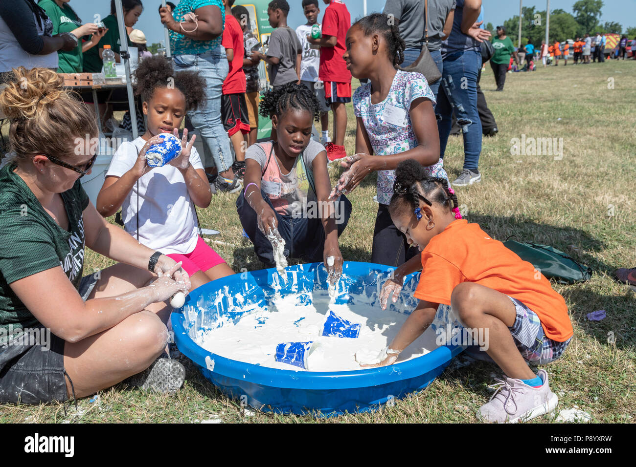 Detroit, Michigan - Children play with oobleck (cornstarch and water ...
