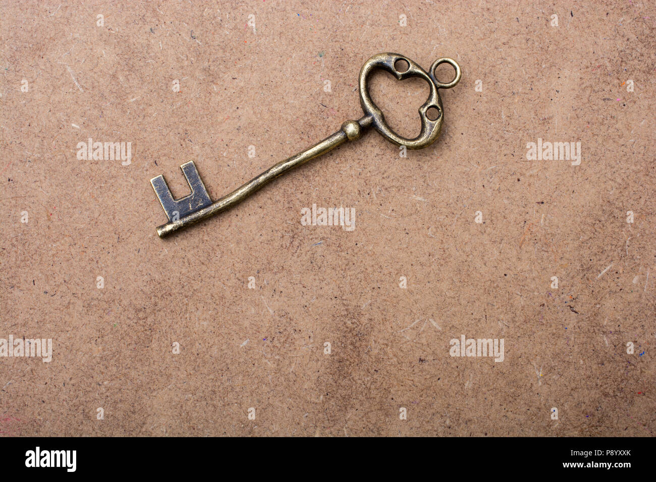 Retro styled golden color key forms the word key Stock Photo - Alamy