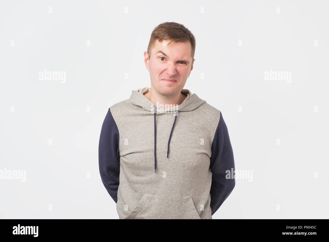 European man is angry with his friends words Stock Photo - Alamy