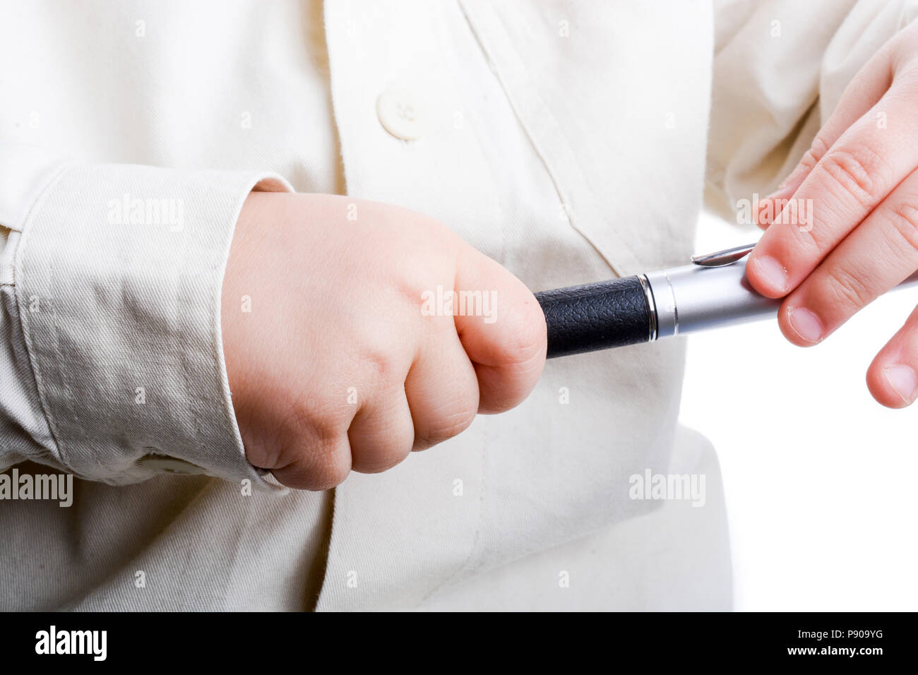 Baby holding a pen in his hand on a white background Stock Photo - Alamy