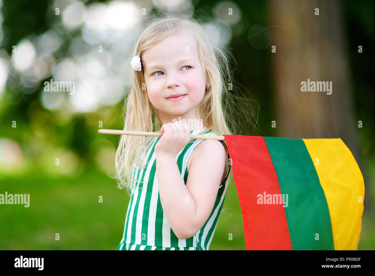 Cute little girl holding tricolor Lithuanian flag on Lithuanian ...