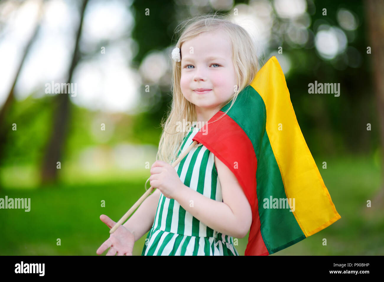 Cute little girl holding tricolor Lithuanian flag on Lithuanian ...