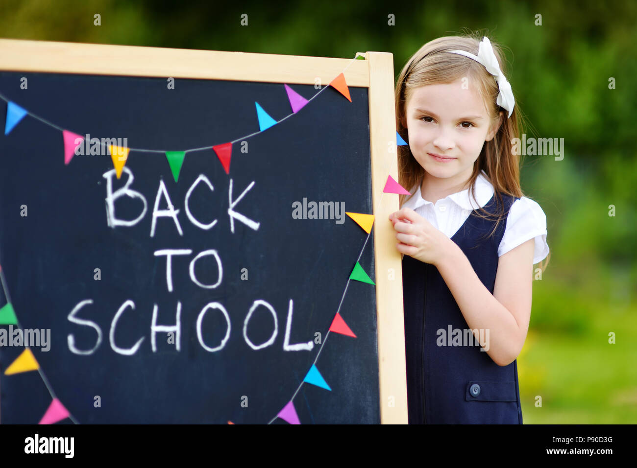 Excited schoolgirl hi-res stock photography and images - Alamy