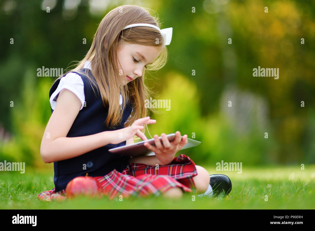 Little girl using computer hi-res stock photography and images - Alamy