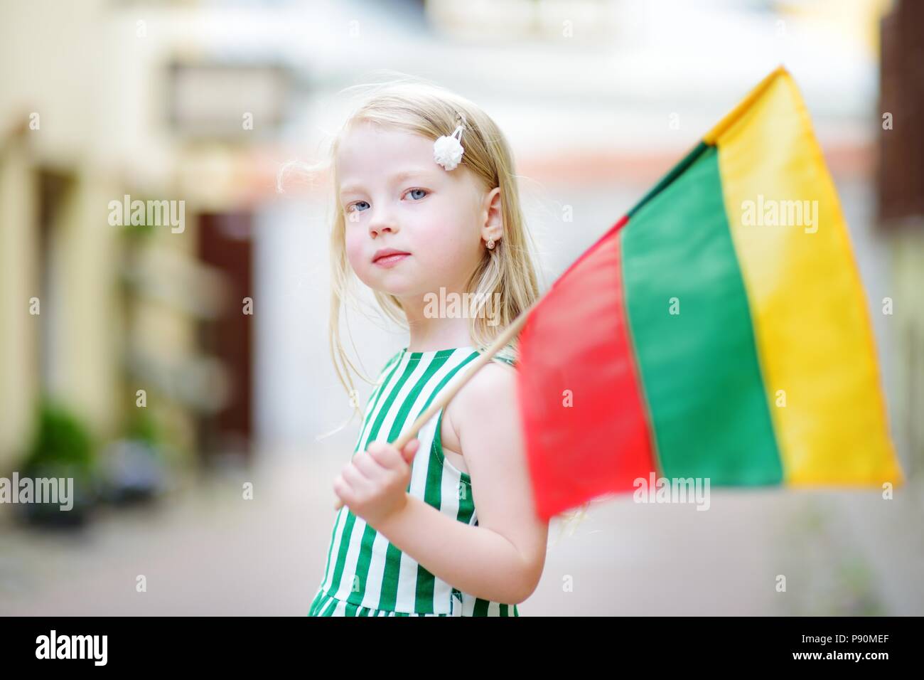 Cute little girl holding tricolor Lithuanian flag on Lithuanian ...