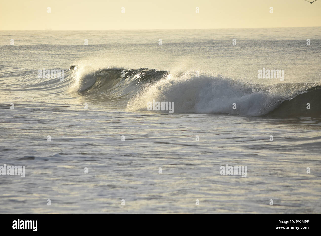 Breathtaking photo of a sunrise off the coast Stock Photo - Alamy
